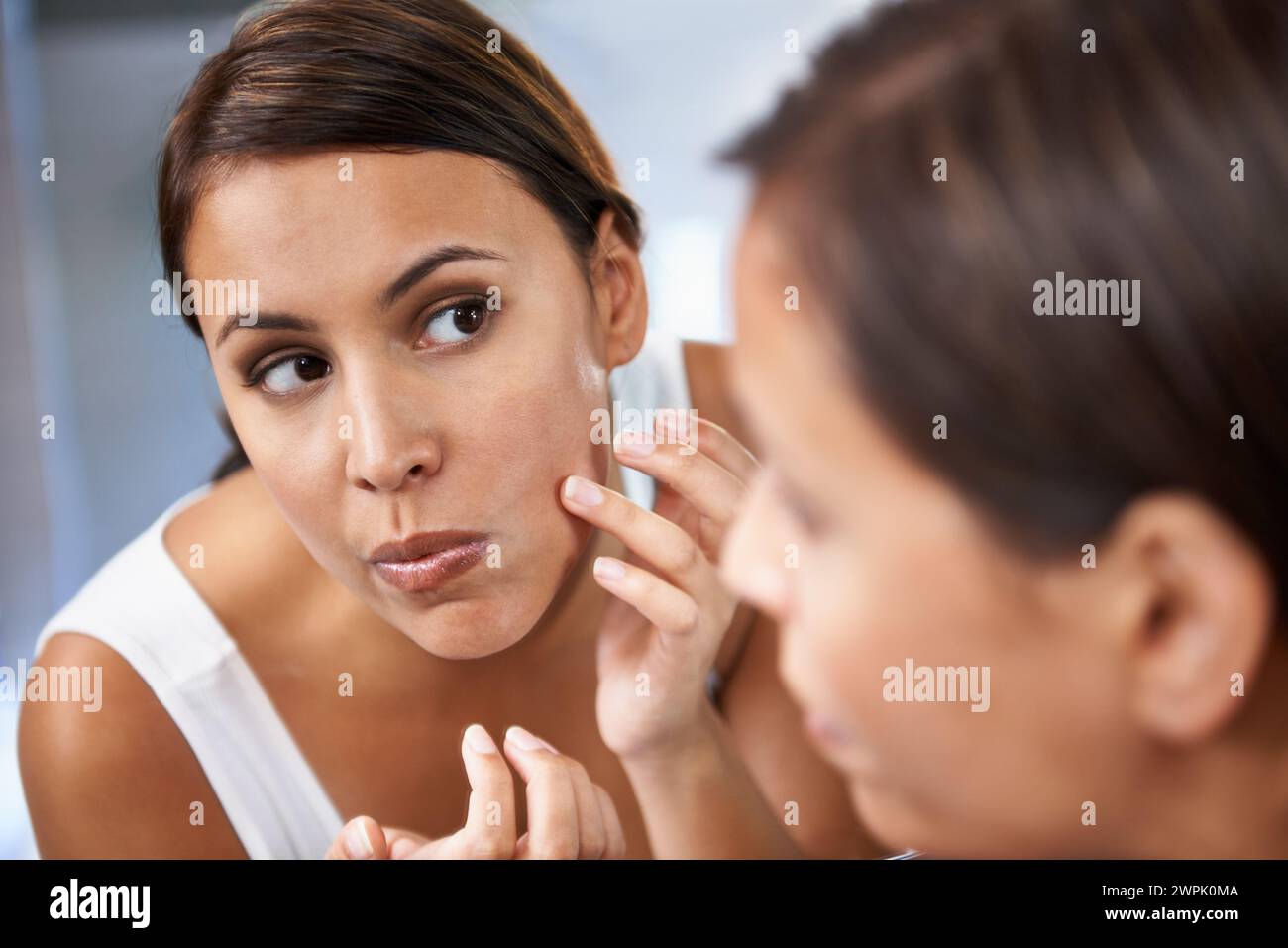 Pimple, woman and skincare in mirror with pores or face spot or acne on ...