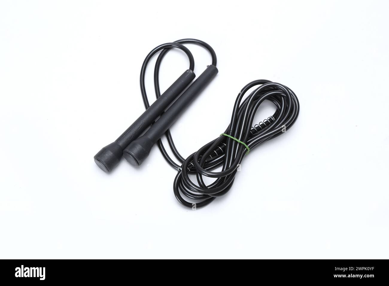 black skipping rope isolated on white background Stock Photo - Alamy