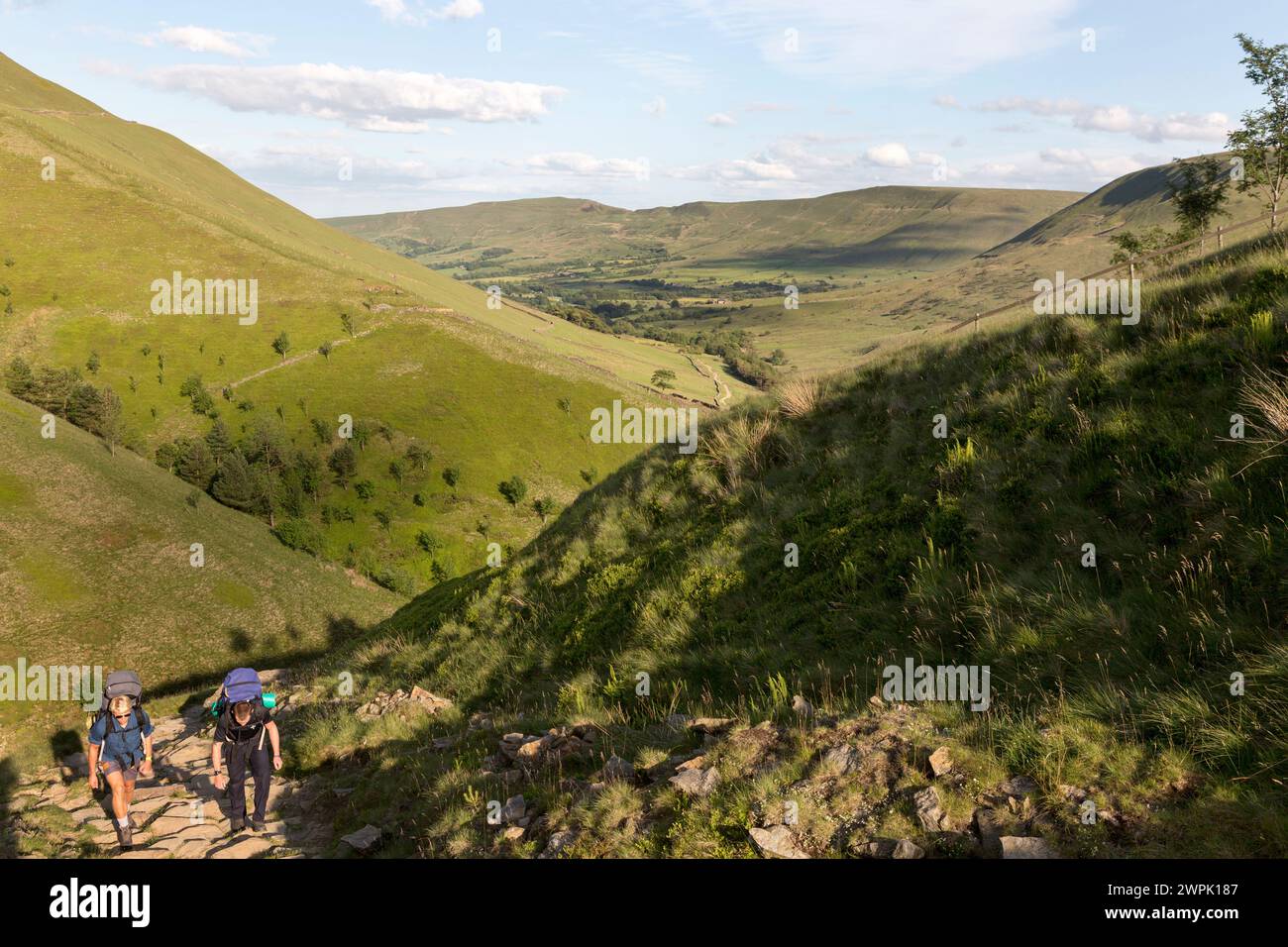 UK, Derbyshire, walkers climbing Jacobs ladder on the Pennine way near ...
