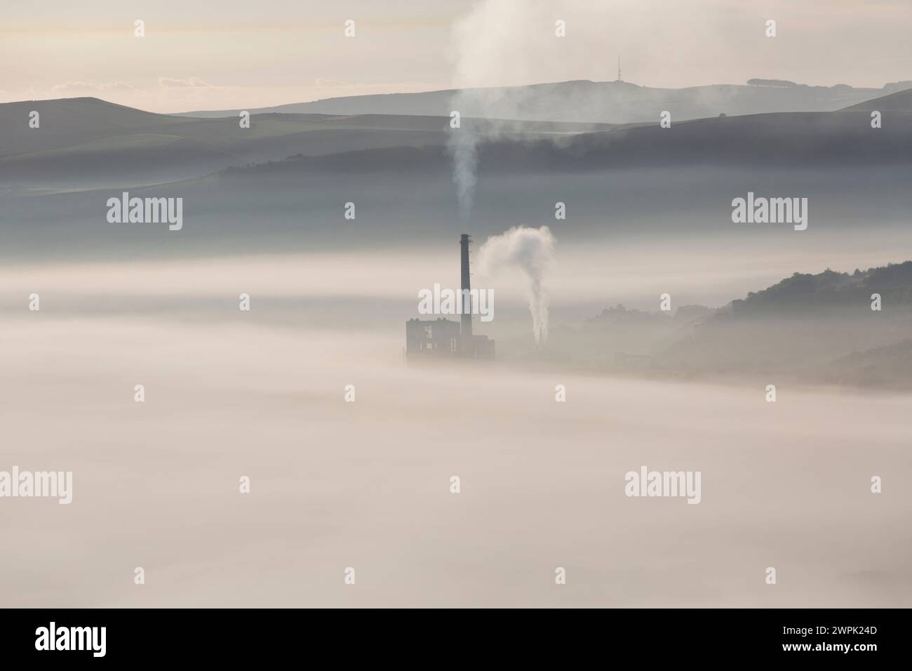 UK, Derbyshire, the Castleton Cement Works chimney in the Hope Valley ...