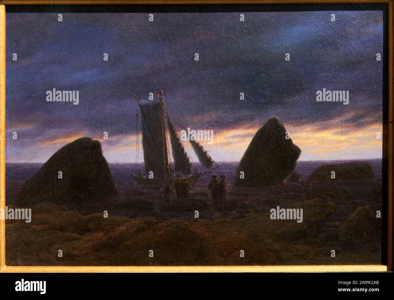 Fishing boat between two rocks by a baltic beach hi-res stock ...