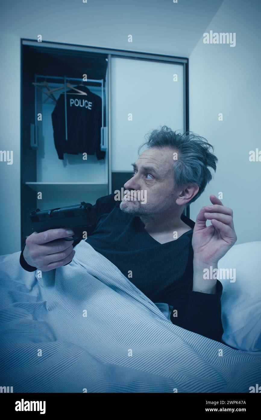 Police officer waking up in his bedroom afraid of intruder Stock Photo ...
