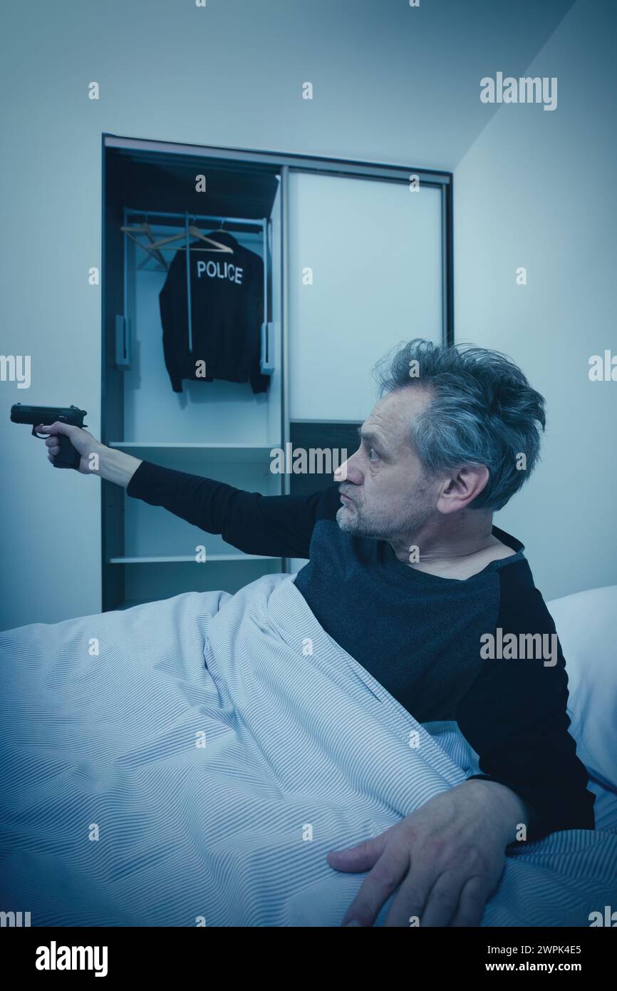 Police officer waking up in his bedroom afraid of intruder Stock Photo ...