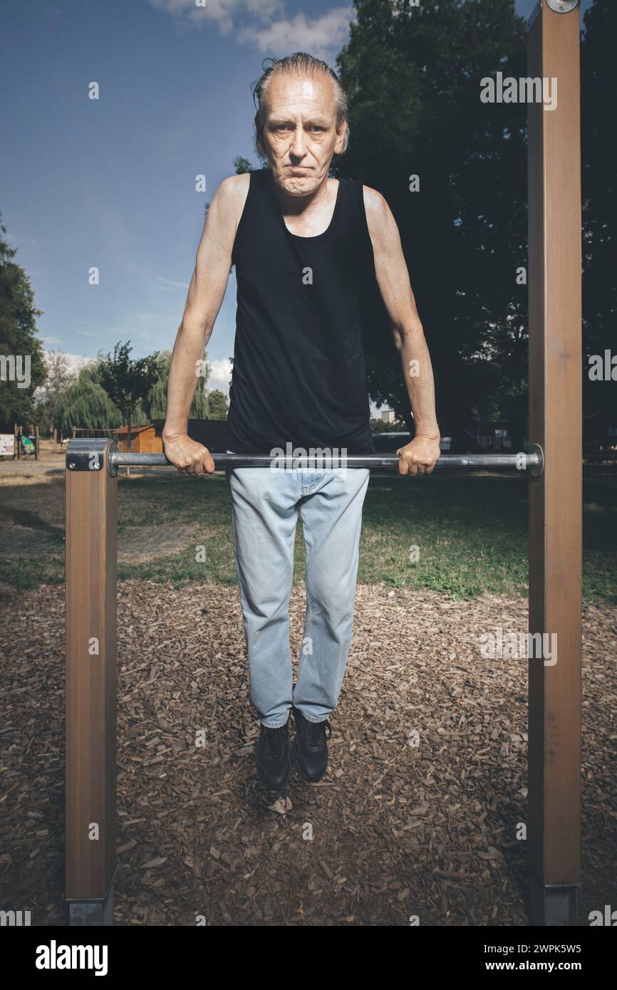 Ugly man of bad condition trying workout in outdoor gym Stock Photo - Alamy