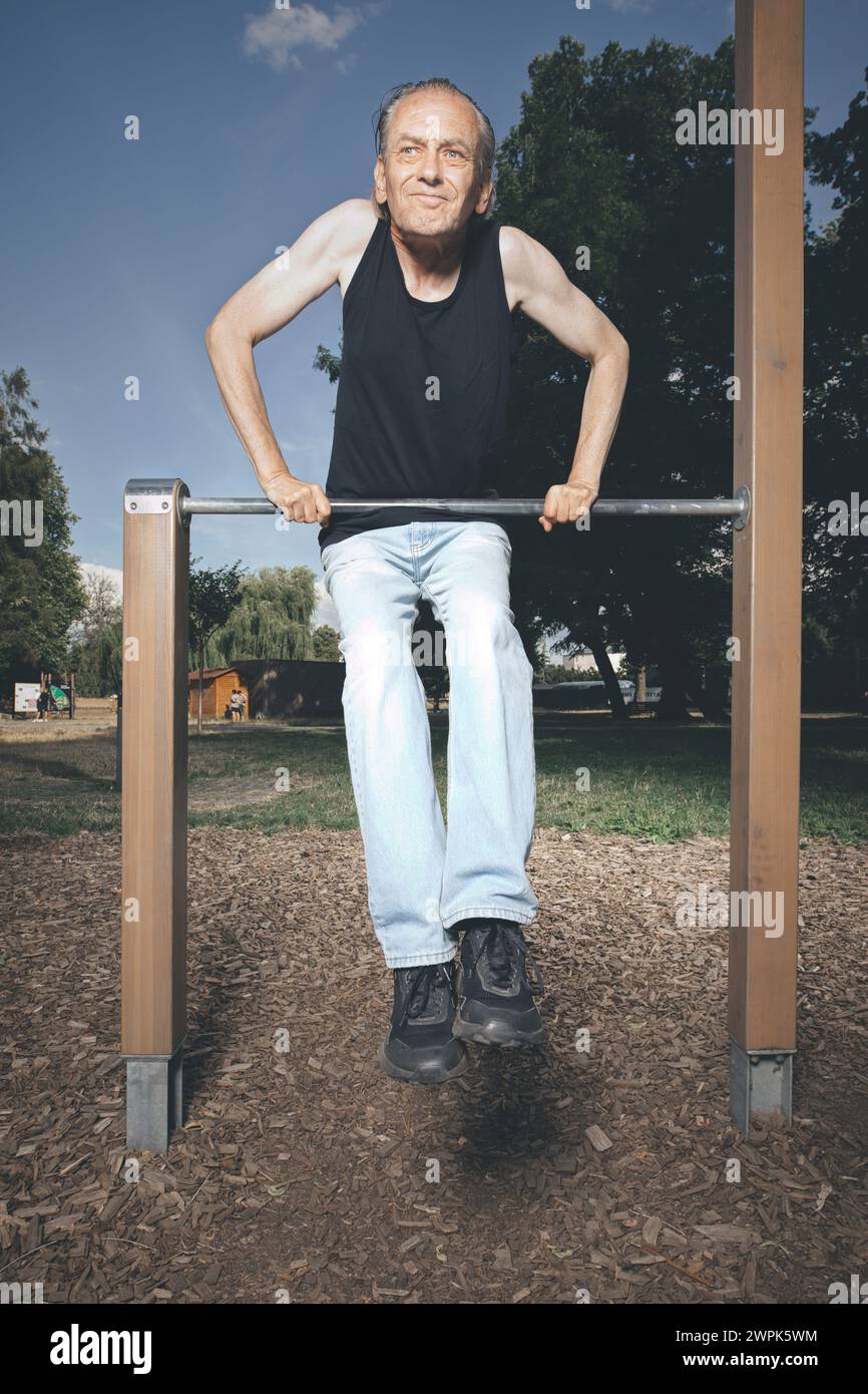 Ugly man of bad condition trying workout in outdoor gym Stock Photo - Alamy
