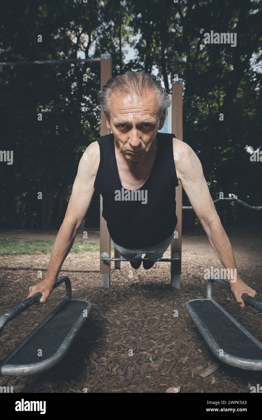 Ugly man of bad condition trying workout in outdoor gym Stock Photo - Alamy