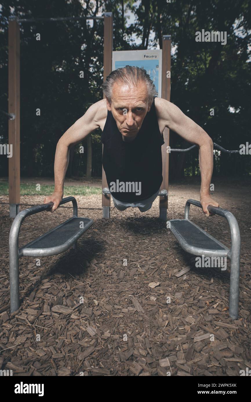 Ugly man of bad condition trying workout in outdoor gym Stock Photo - Alamy