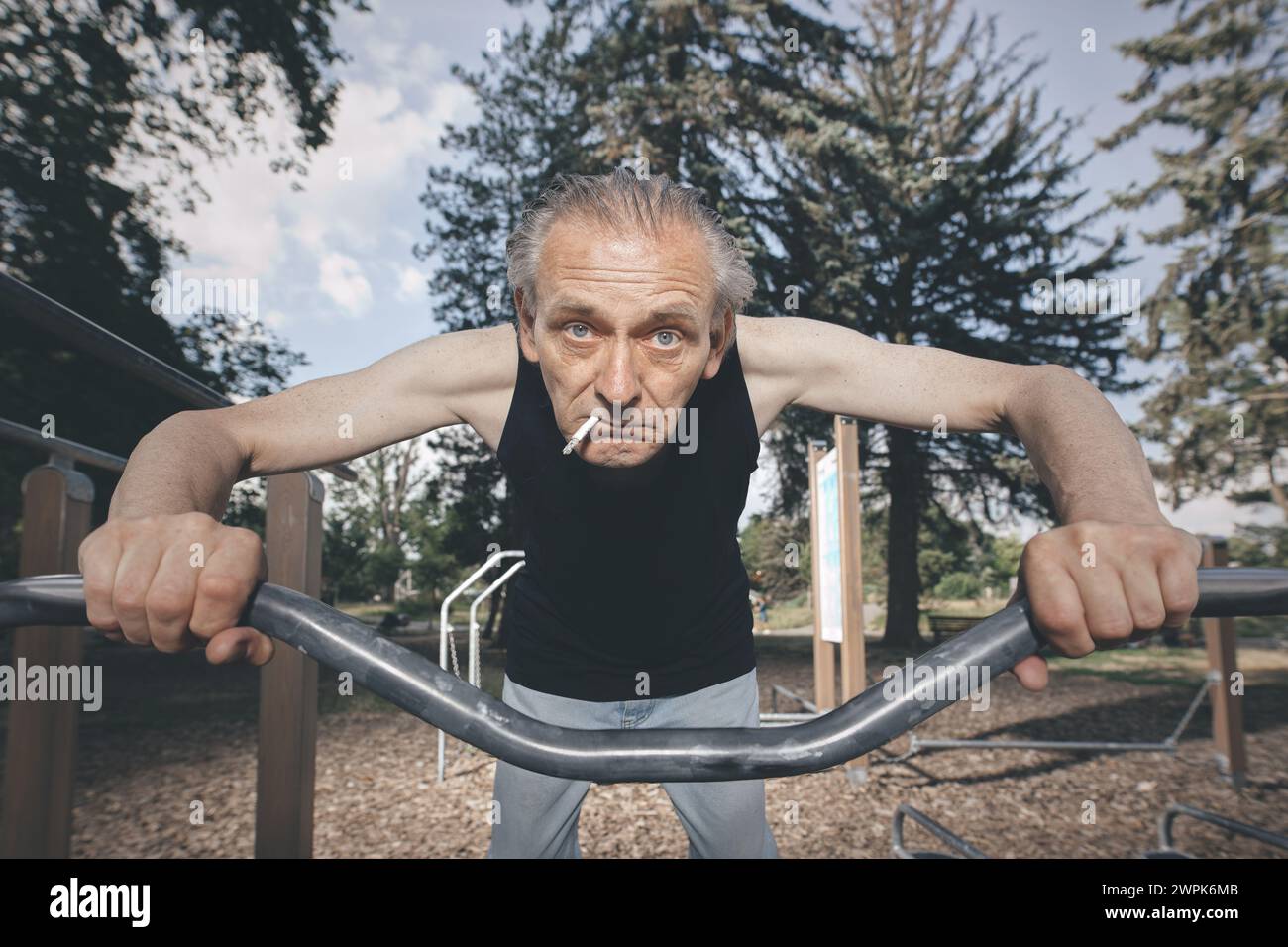 Ugly man of bad condition trying workout in outdoor gym Stock Photo - Alamy