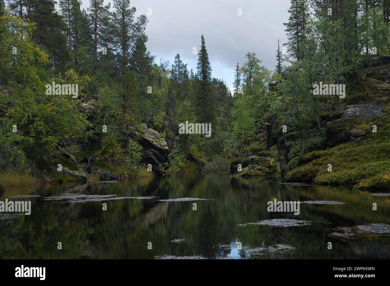 Pond near cliffs in Pallas-Yllästunturi National Park, Muonio, Lapland ...