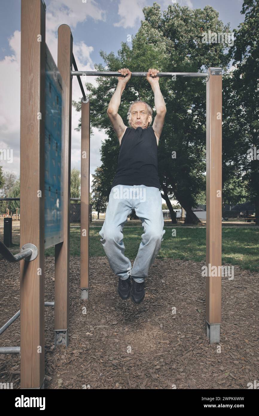 Ugly man of bad condition trying workout in outdoor gym Stock Photo - Alamy