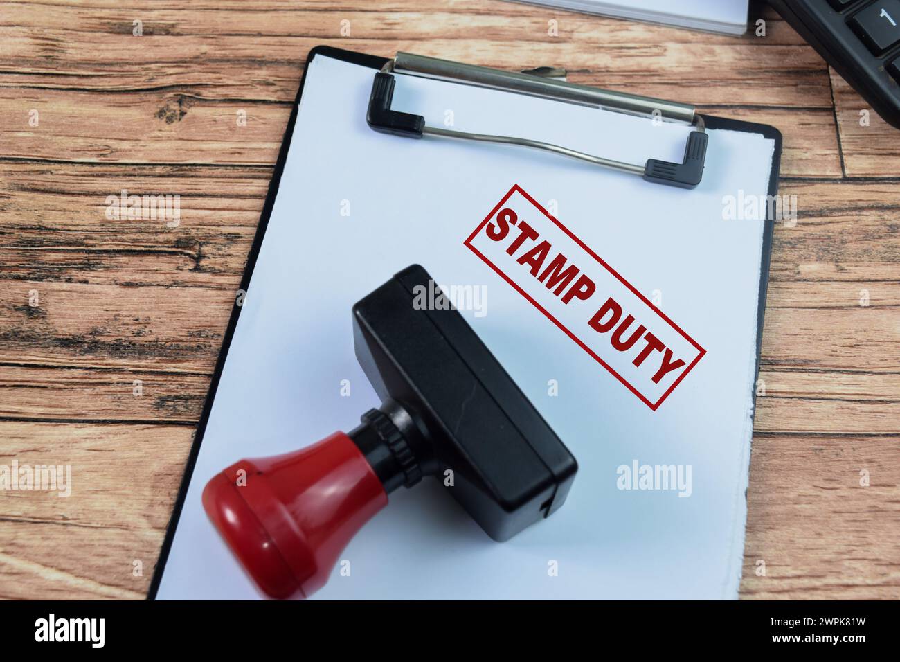 Red Handle Rubber Stamper and Stamp Duty text above paperwork isolated ...