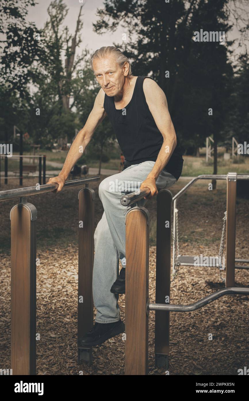 Ugly man of bad condition trying workout in outdoor gym Stock Photo - Alamy