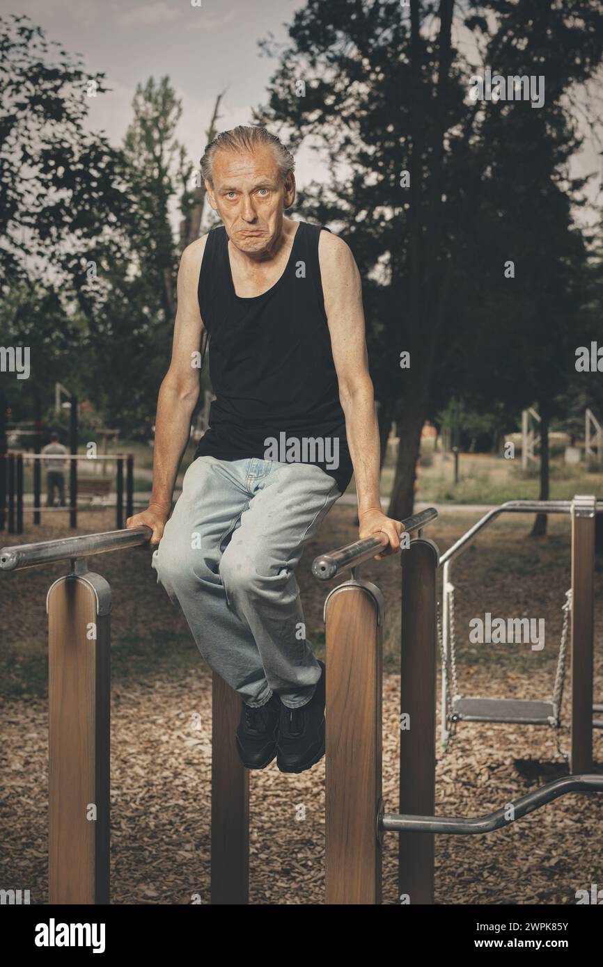 Ugly man of bad condition trying workout in outdoor gym Stock Photo - Alamy