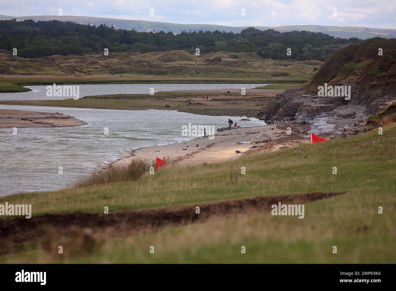 The river mouth estuary where the Ogmore river meets the sea as it travels past the Merthyr Mawr ...