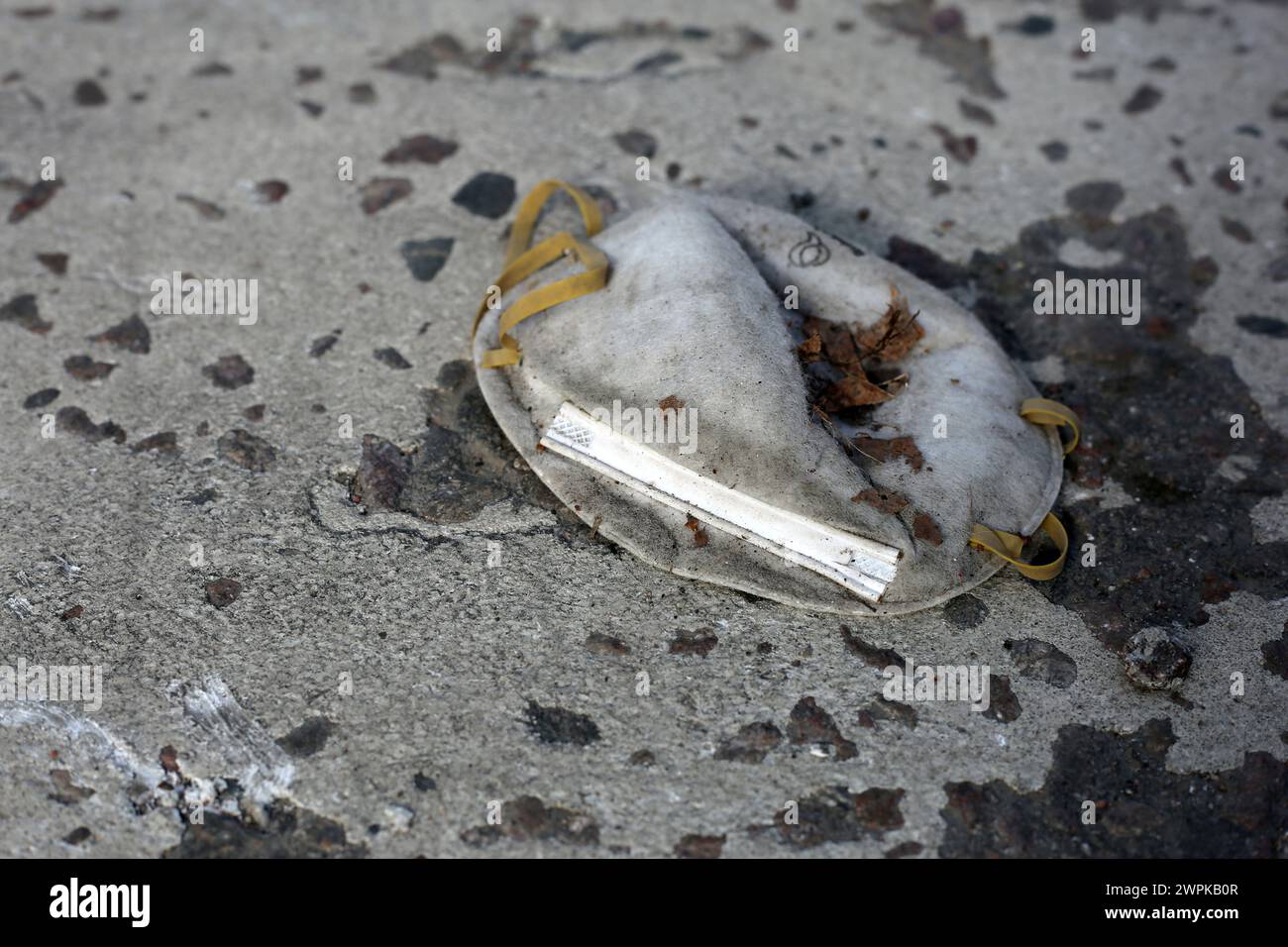 Espoo, Finland - April 2020: Used FFP mask thrown to ground. Dirty old ...