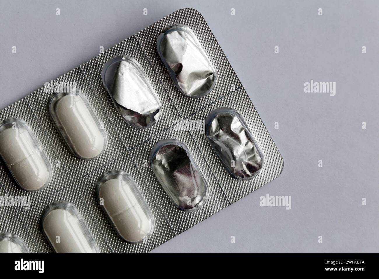 No logo white tablets. Different pills can be used in healthcare to ...