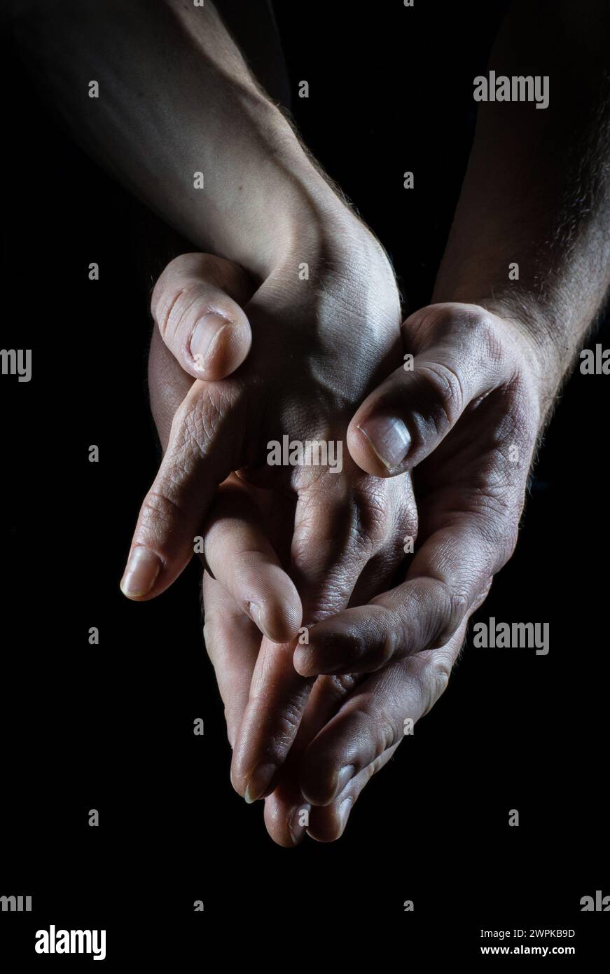 Two people hold hands sharing hi-res stock photography and images - Alamy