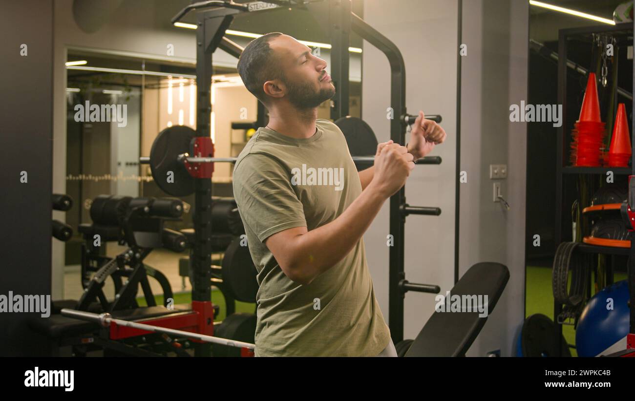 Funny happy carefree silly American Latino ethnic man athlete fit sport ...