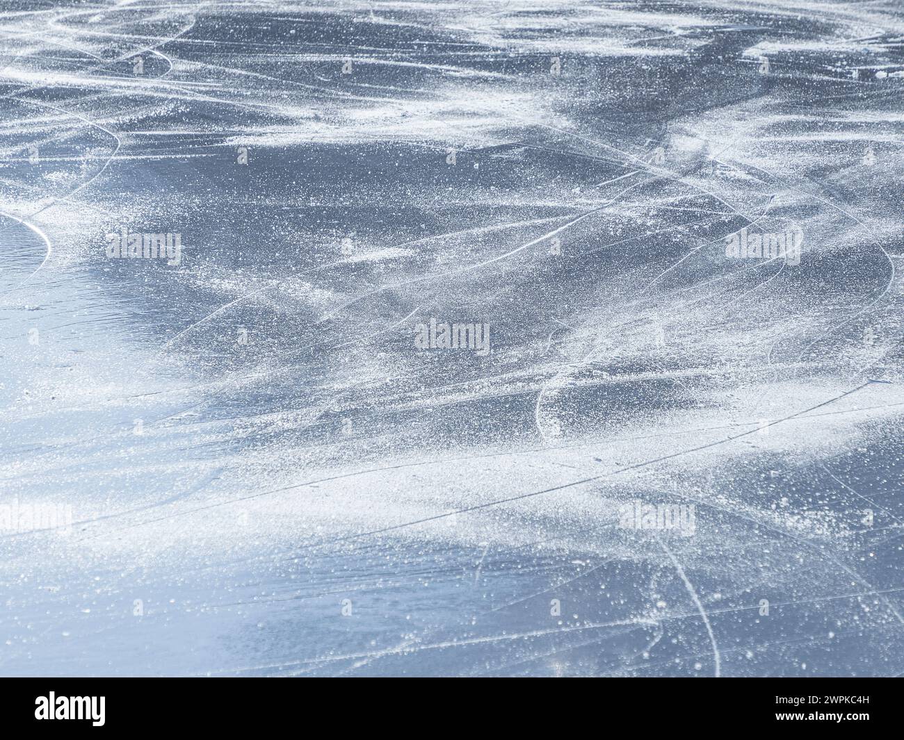Ice texture on a skating rink, tracks on the ice from skates, frozen ...
