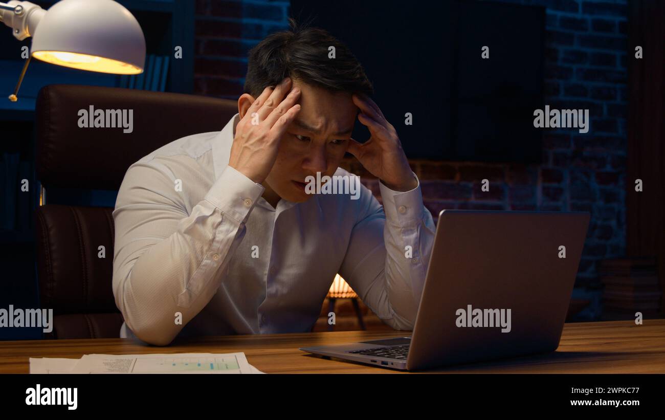 Stressed exhausted ill sad tired Asian mature man overworked Korean ...