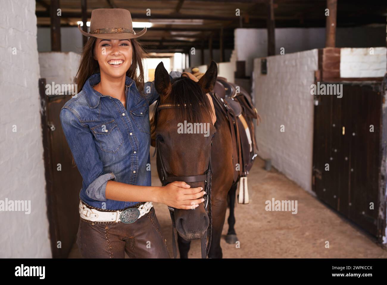 Woman or cowgirl, portrait and horse in stable to train or feed and ...