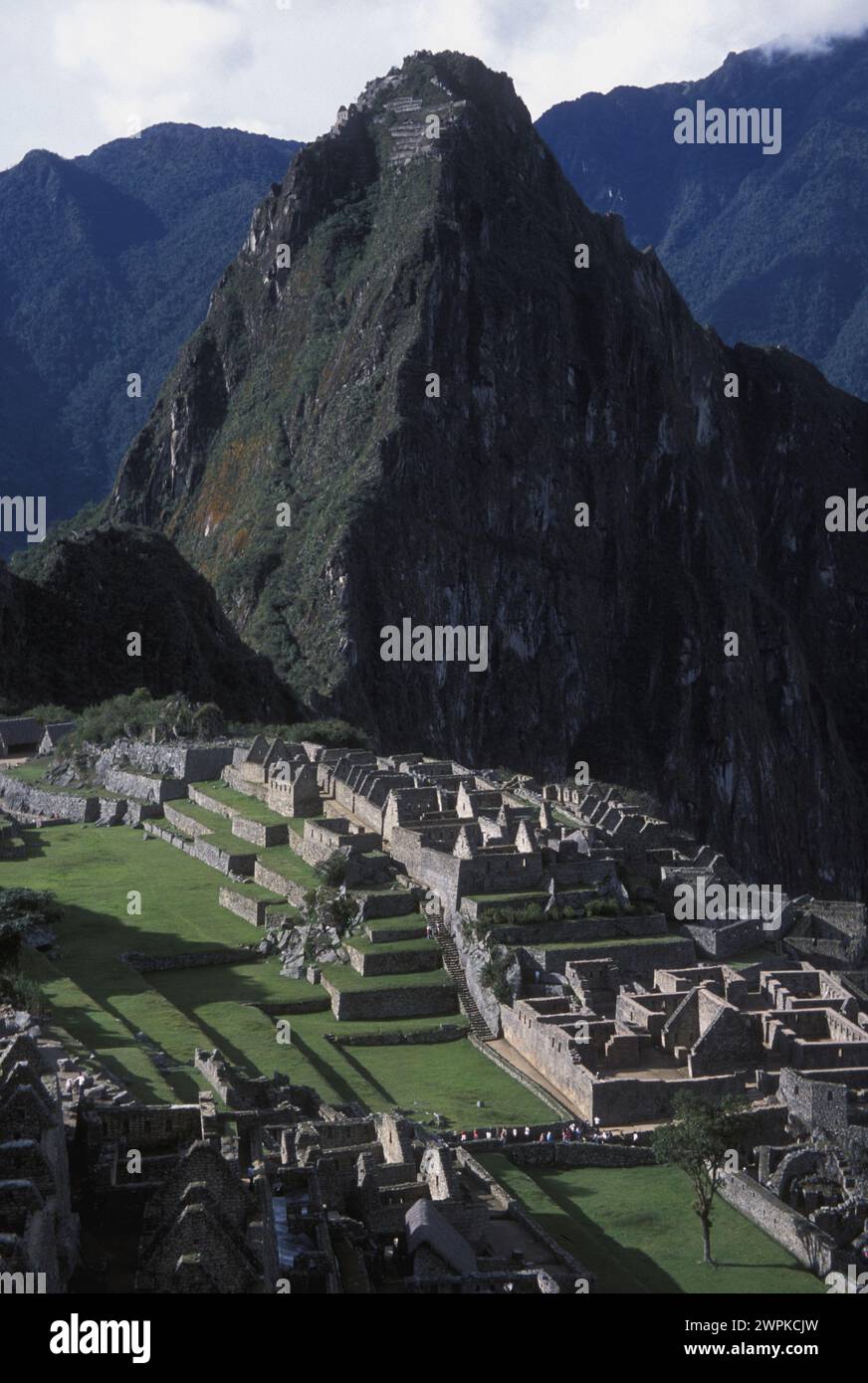 A huge rock surrounded by the structures for Inca, Peru, South America ...