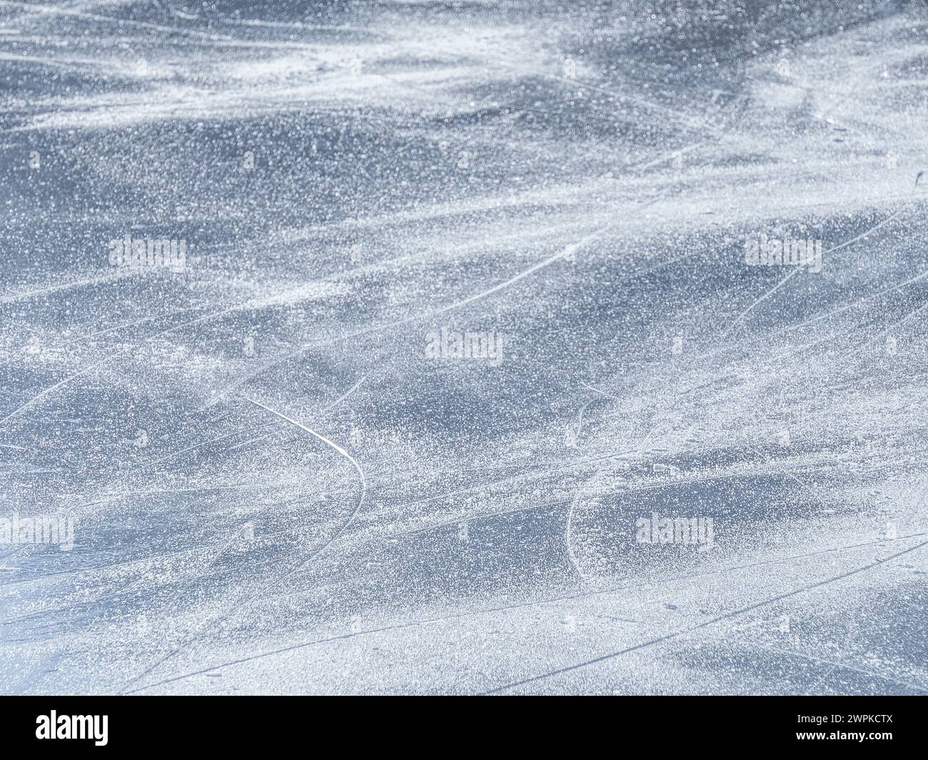Ice texture on a skating rink, tracks on the ice from skates, frozen ...