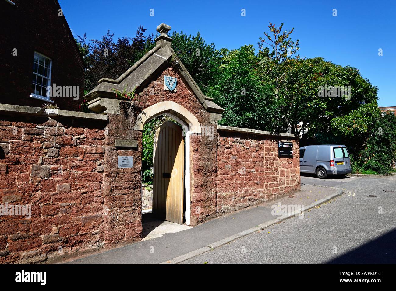 Entrance arch to the Old Deanery in the city centre, Exeter, Devon, UK ...