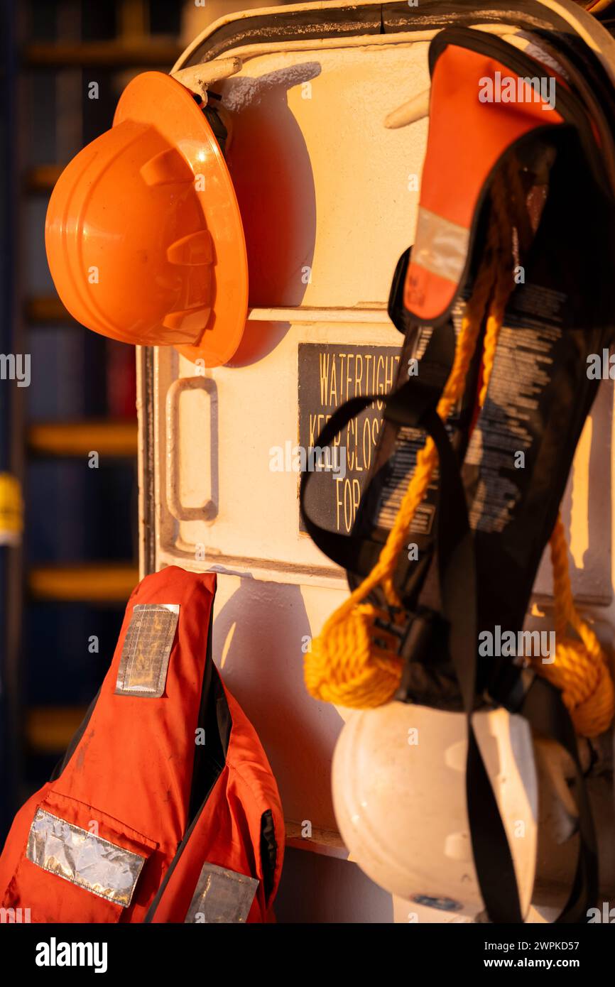 Hard hat and life jackets on door in the Gulf of Mexico Stock Photo - Alamy