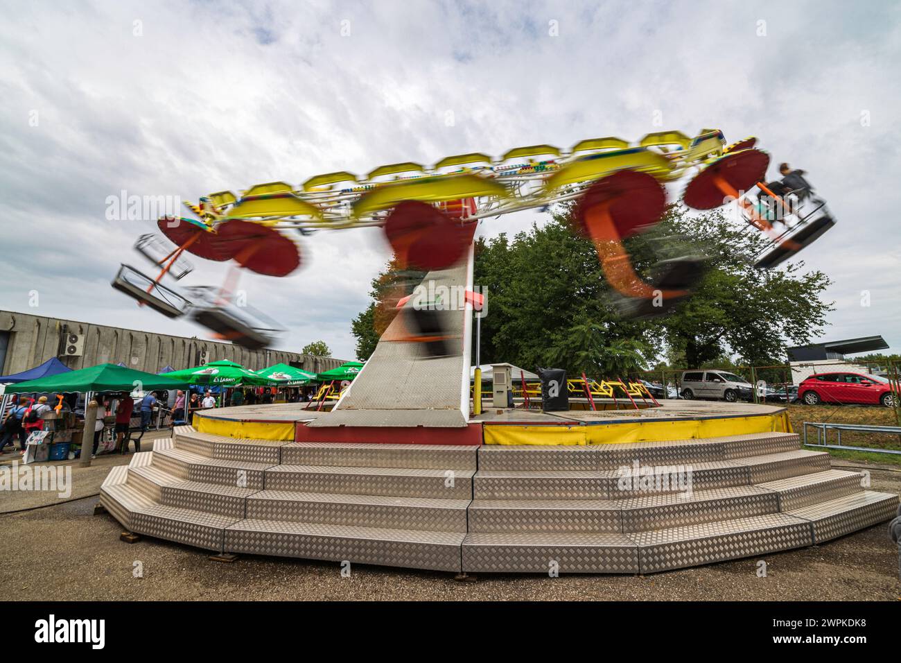 A carousel at a funfair captured with a long shutter speed or a long ...