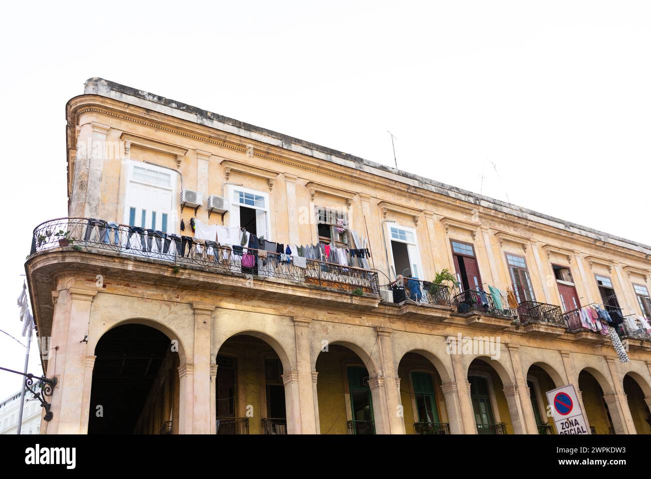 Peach building with balconies and hanging laundry in Havana Stock Photo ...