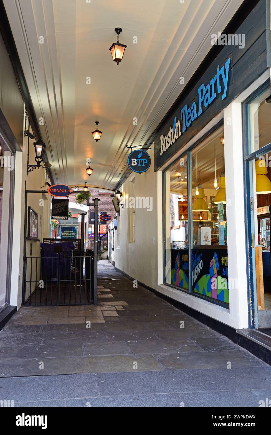 Shops inside an alleyway off Queen Street in the city centre, Exeter ...