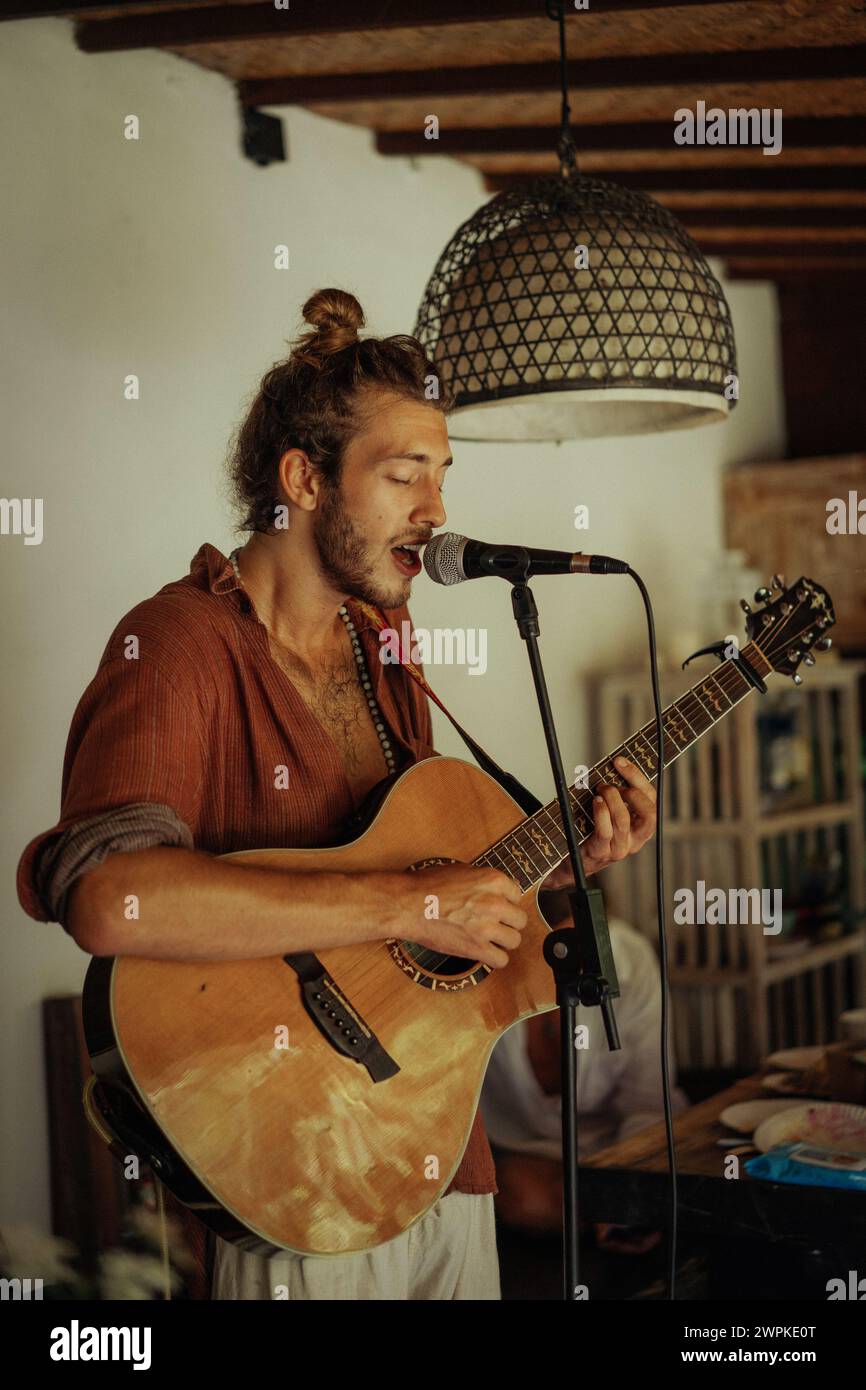 Guitar with hand and microphone hi-res stock photography and images - Alamy