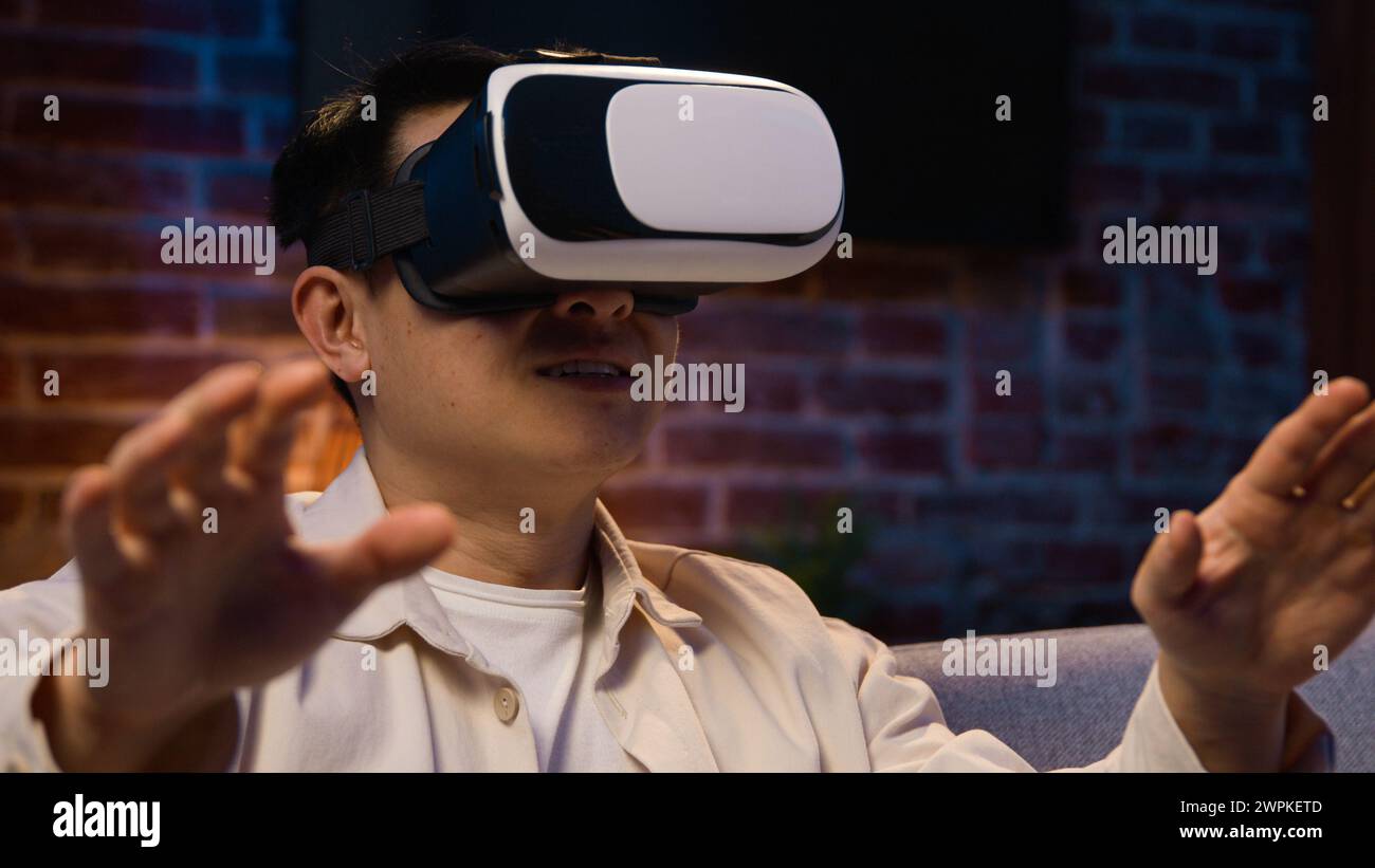 Asian adult man using modern technology explore virtual reality with 3d ...