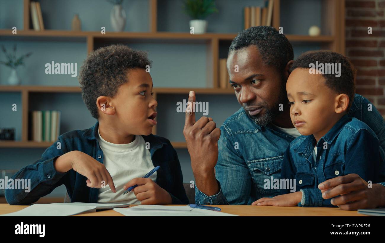 Single parent African American father man private teacher with two boys ...