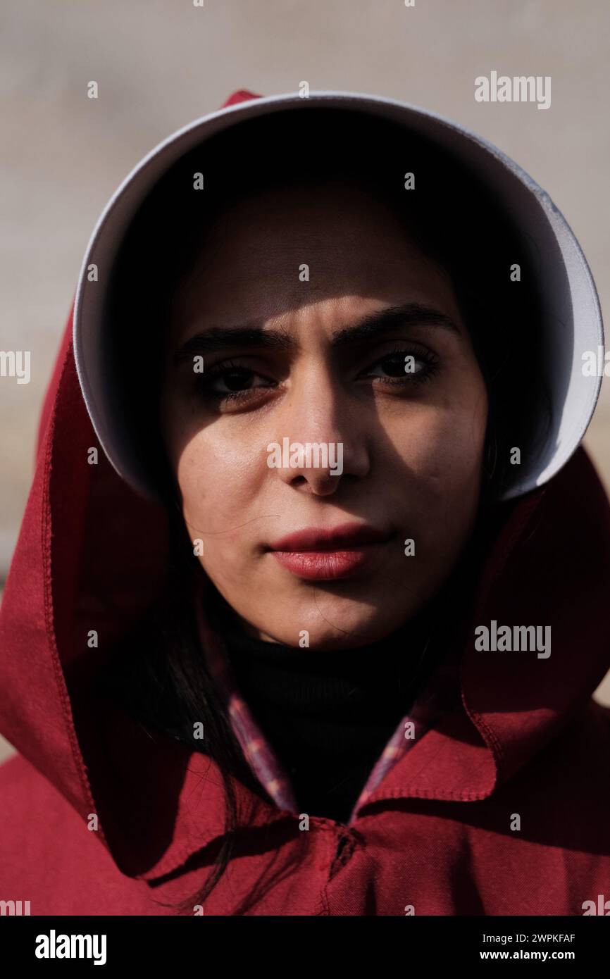 London, UK. 8th Mar, 2024. Iranian women wear the “Handmaid's Tale ...