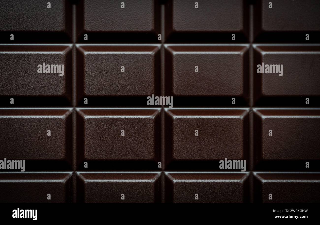 Close up macro of squares of a bar of dark chocolate from above Stock ...