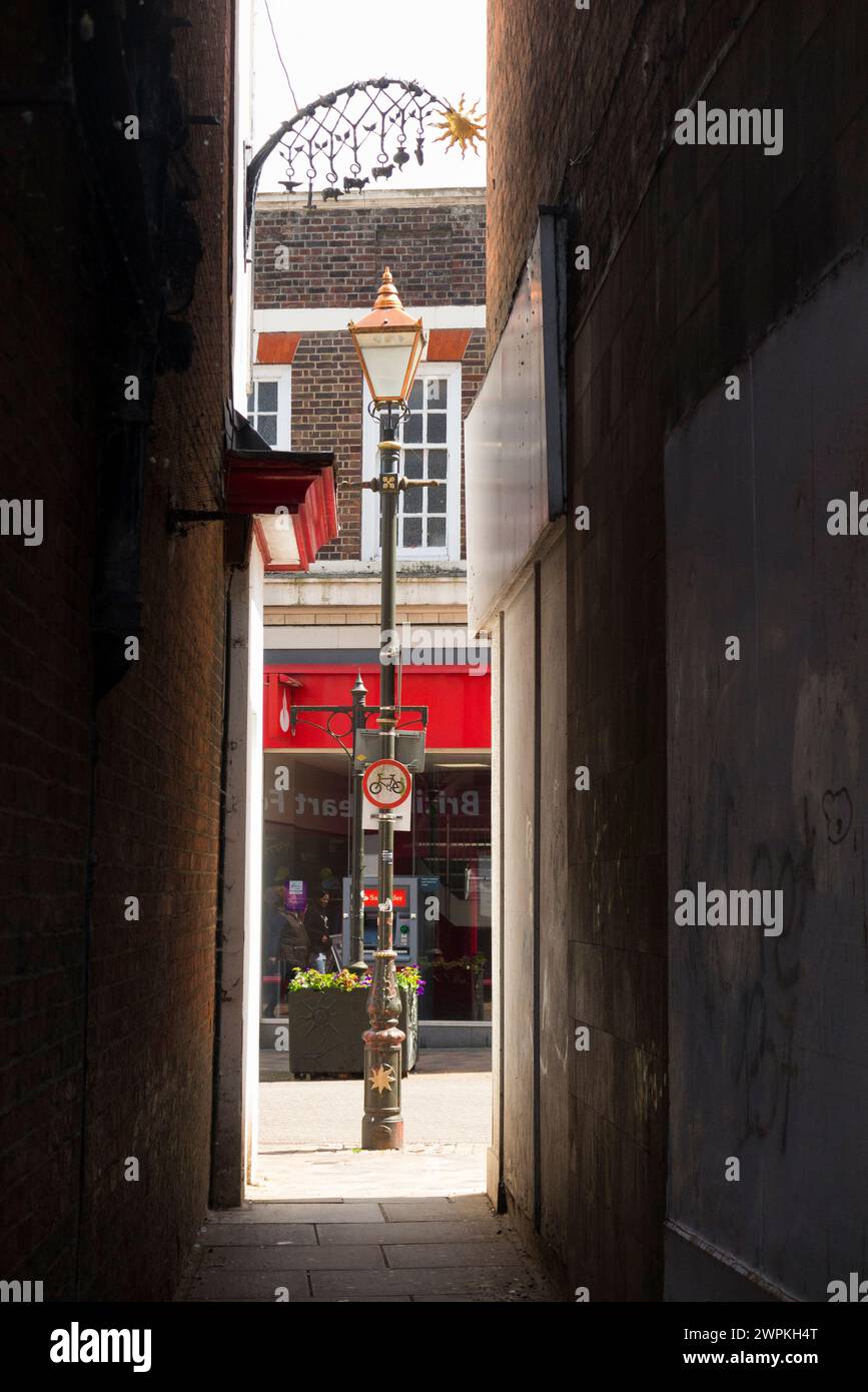 Narrow and claustrophobic, probably very old, access alley path between ...
