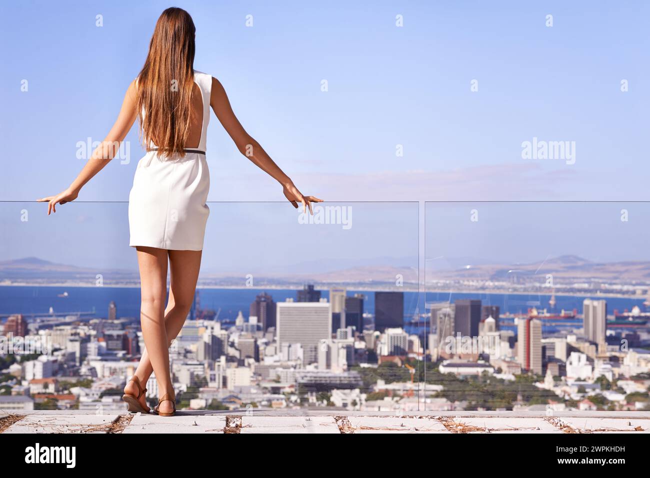 Woman, balcony and building at office in urban view with confidence ...