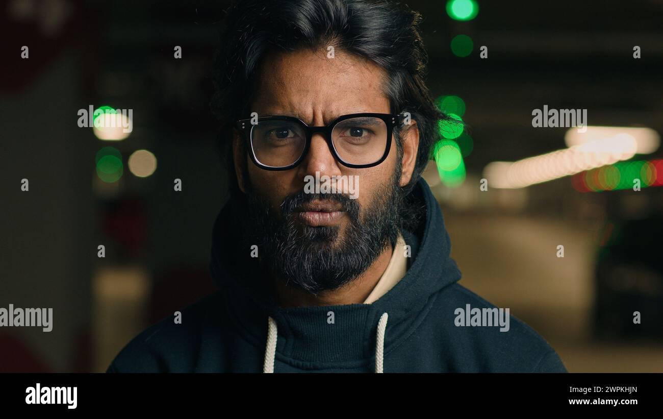 Close up Indian shocked wonder man in eyeglasses looking at camera with ...