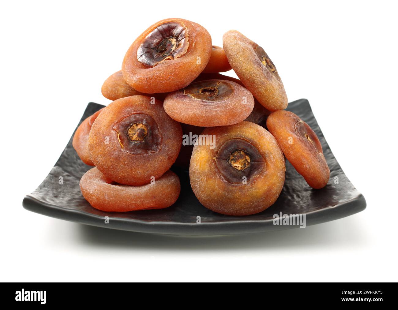 dried persimmon on white background Stock Photo - Alamy