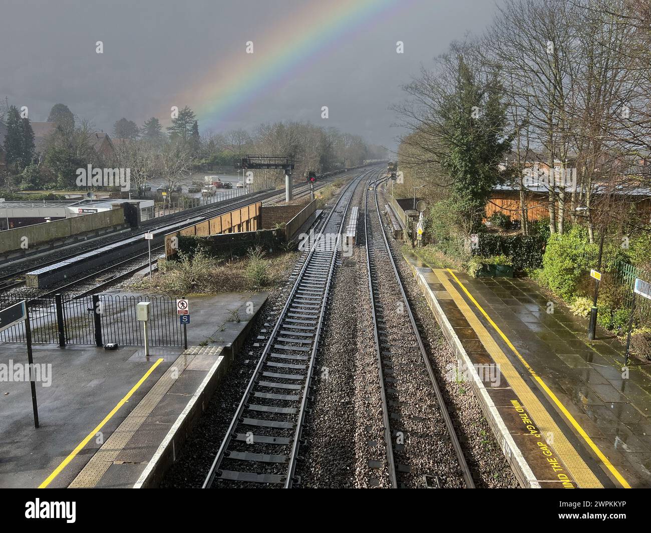 British Network Rail passenger commuter suburban station West Midlands England UK Rainbow over ...