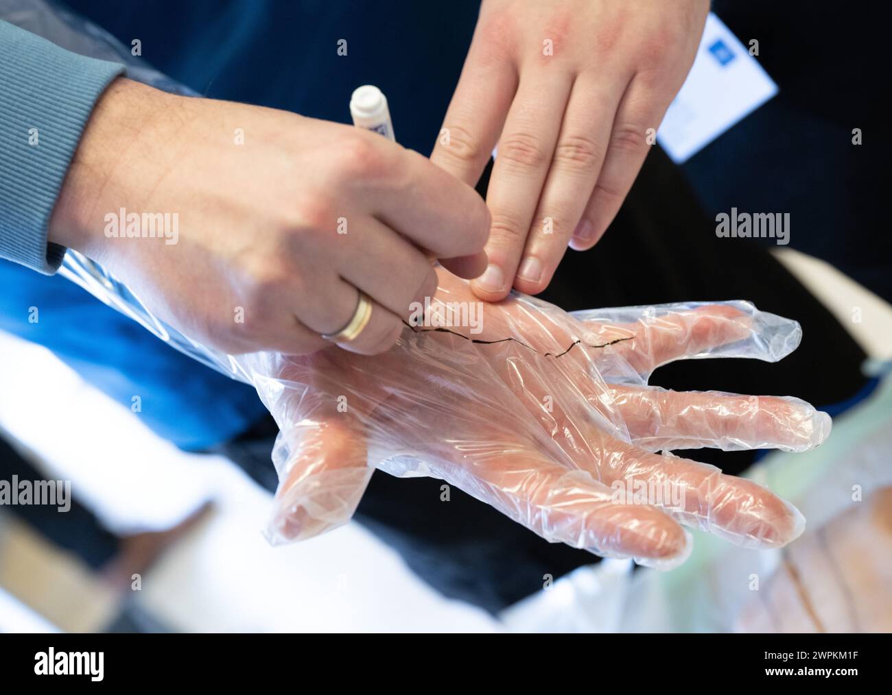 08 March 2024, Hesse, Frankfurt/Main: Trainers simulate the correct use ...