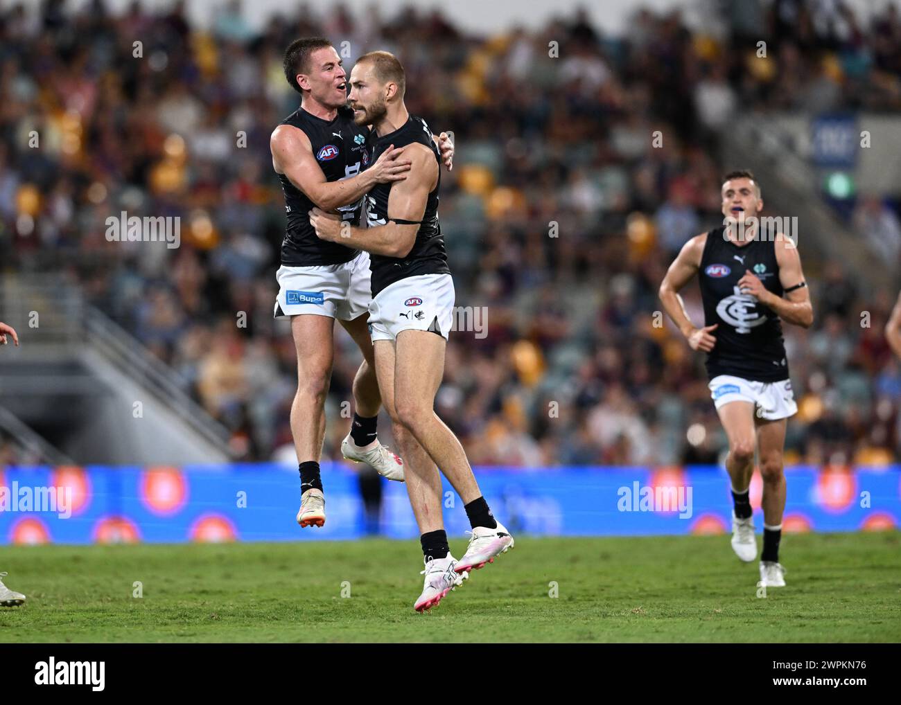 Brisbane, Australia. 08th Mar, 2024. Harry McKay (right) of the Carlton ...