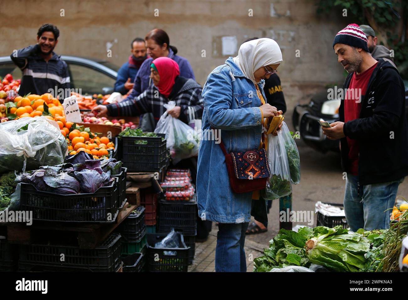 Beirut. 7th Mar, 2024. Local people buy goods ahead of Ramadan at a ...