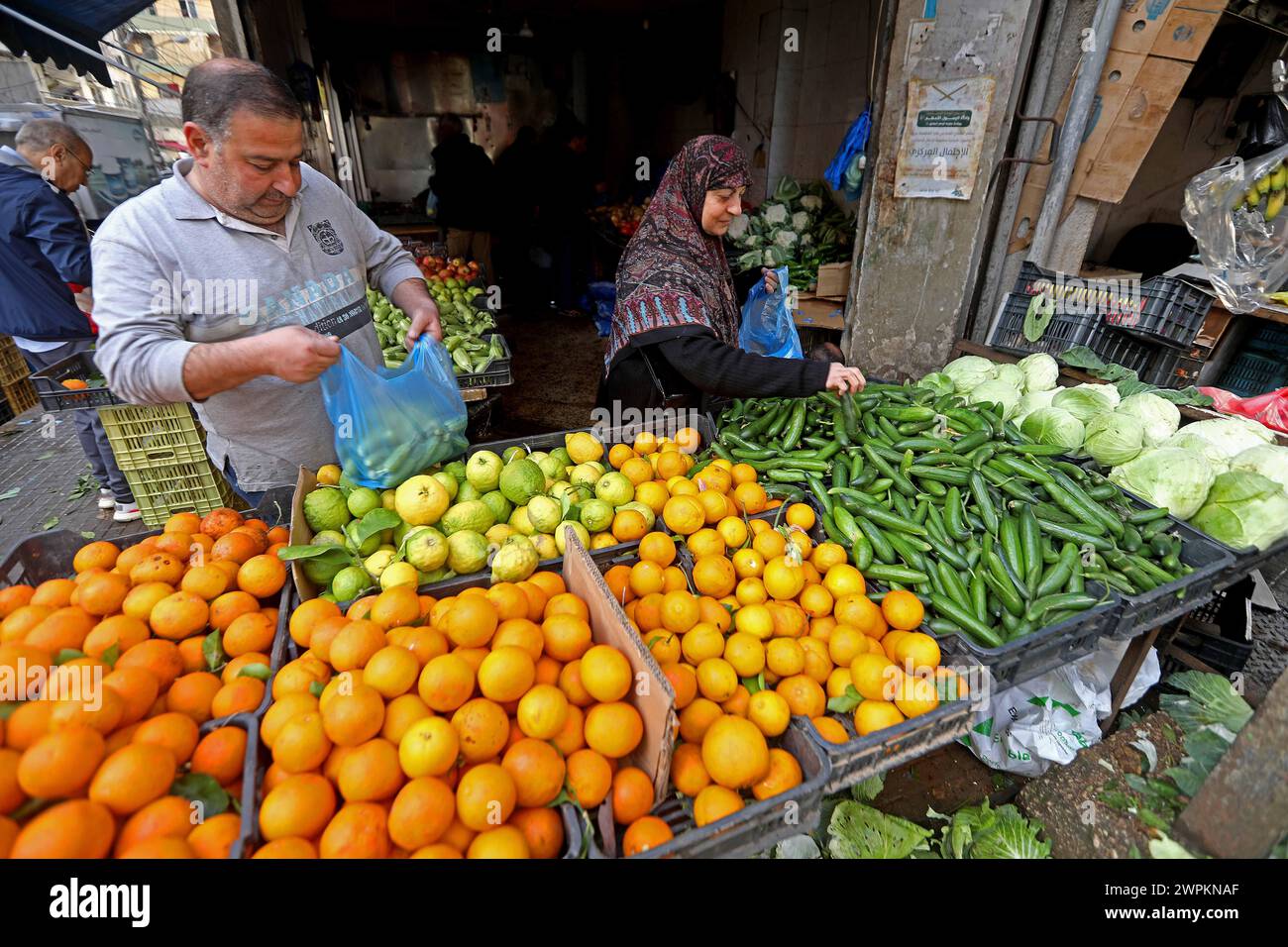 Beirut. 7th Mar, 2024. Local people buy goods ahead of Ramadan at a ...