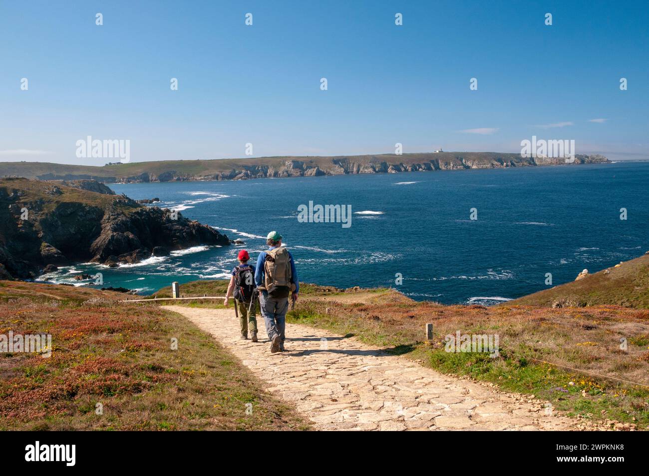 Hikers at Pointe du Van near Saint-They chapel, Trepasses bay and ...