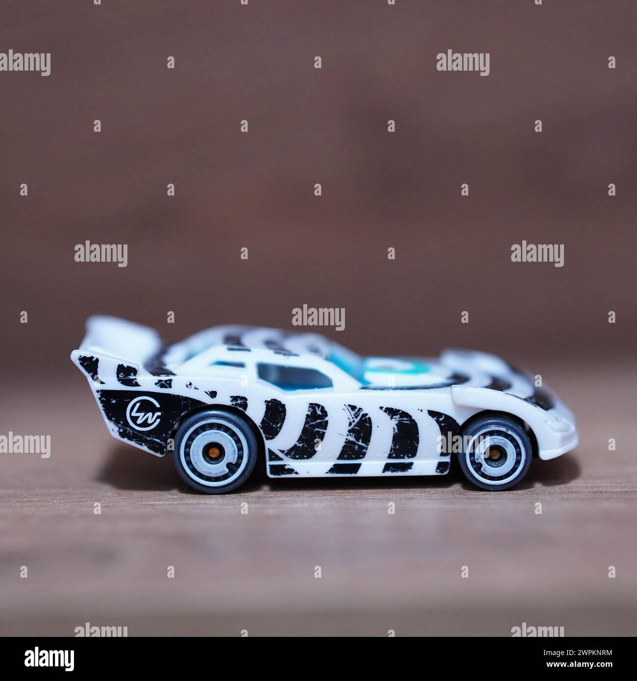 A miniature Hot Wheels toy race car on a table Stock Photo - Alamy