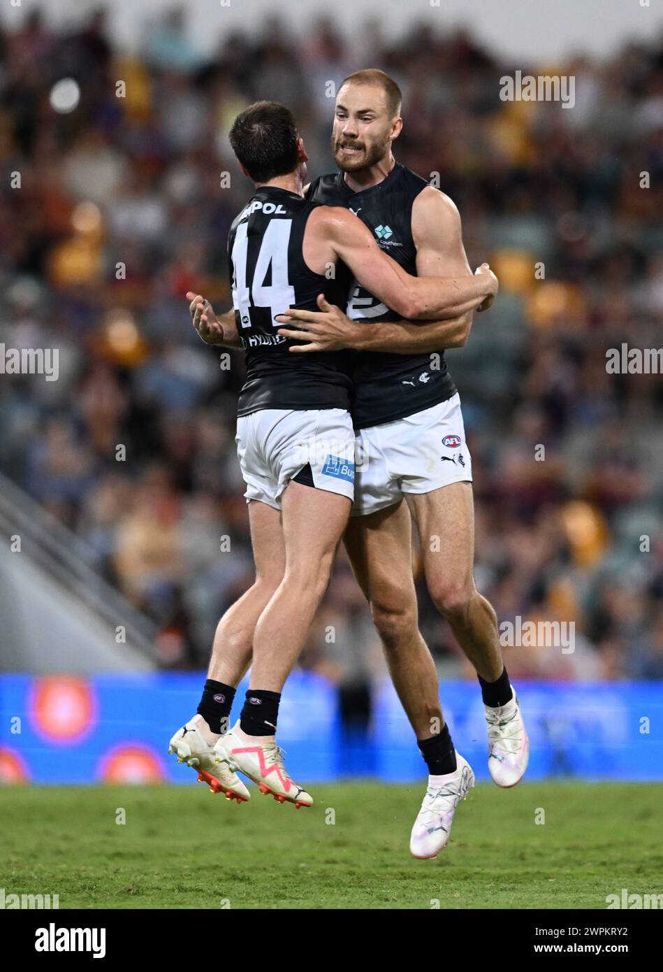 Brisbane, Australia. 08th Mar, 2024. Harry McKay (right) of the Carlton ...