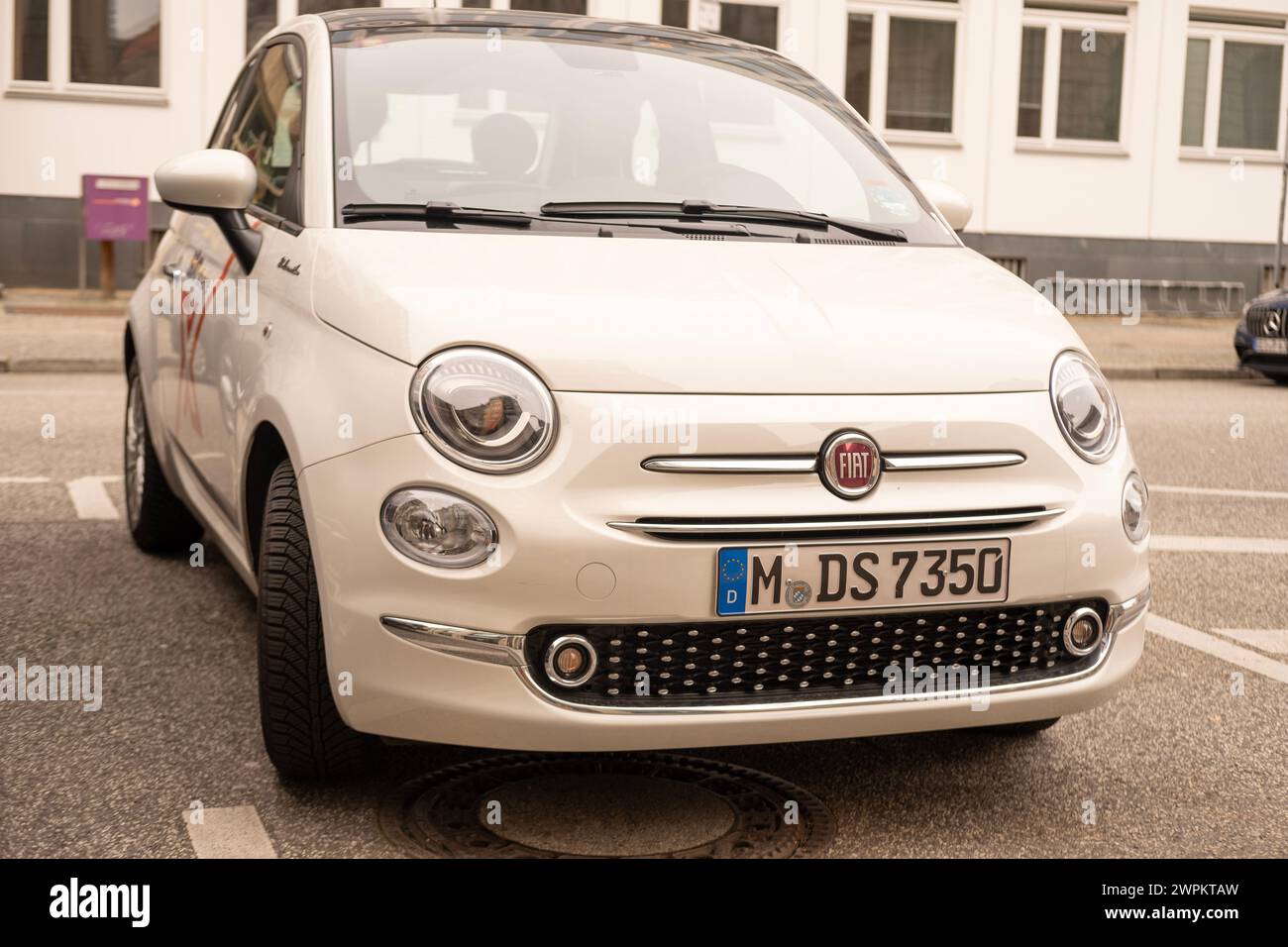 modern white Electric Fiat 500 classic Hatchback car parked in parking ...